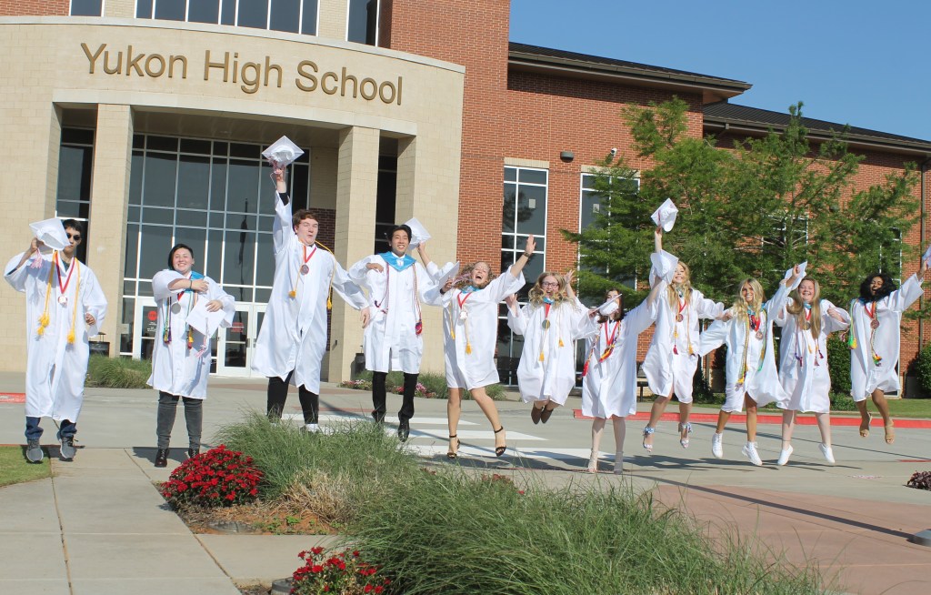 Top scholars distinguished by white robes at YHS graduation - Yukon ...